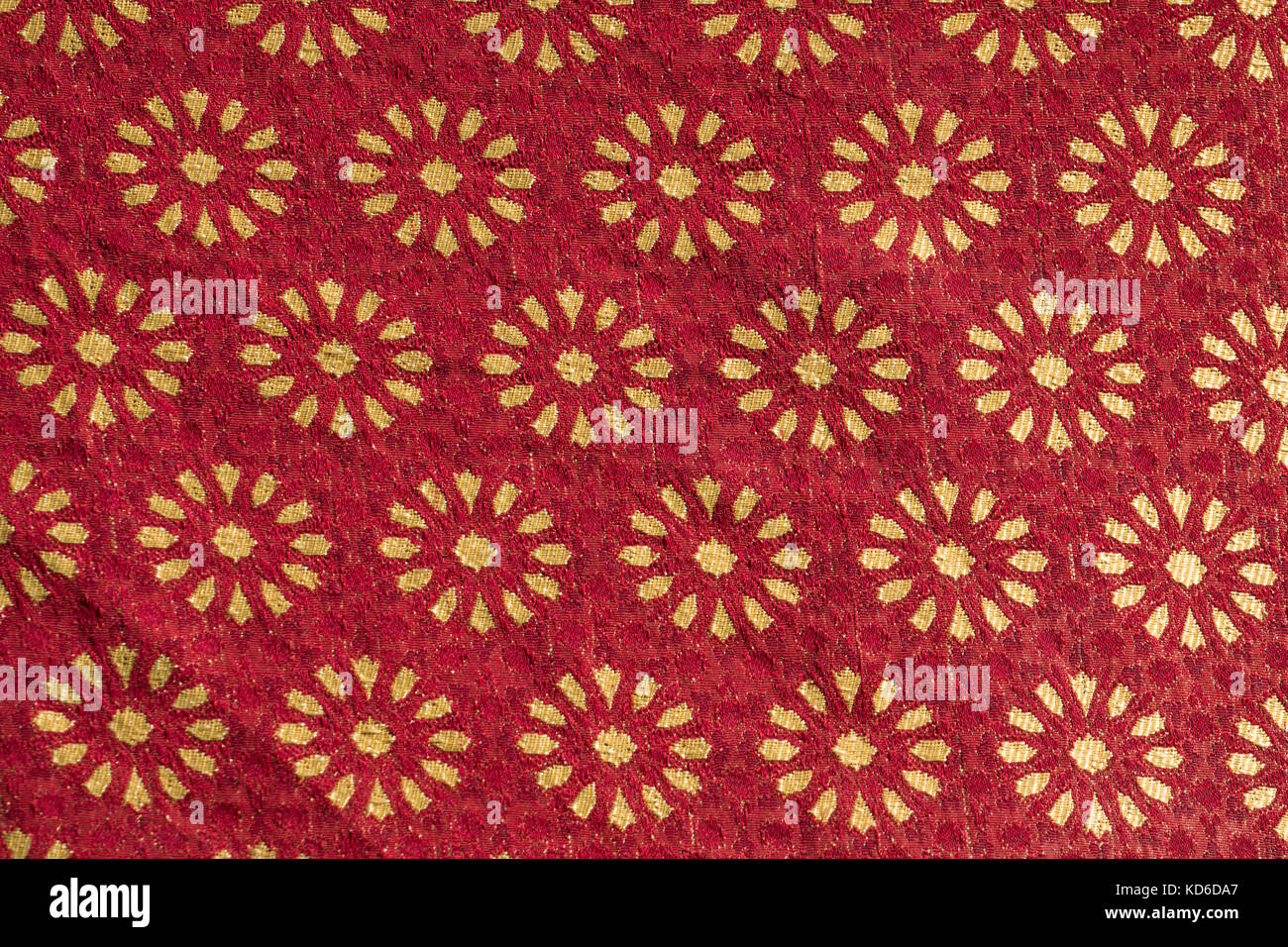 Close up view of Traditional red and golden medieval fabric design ...