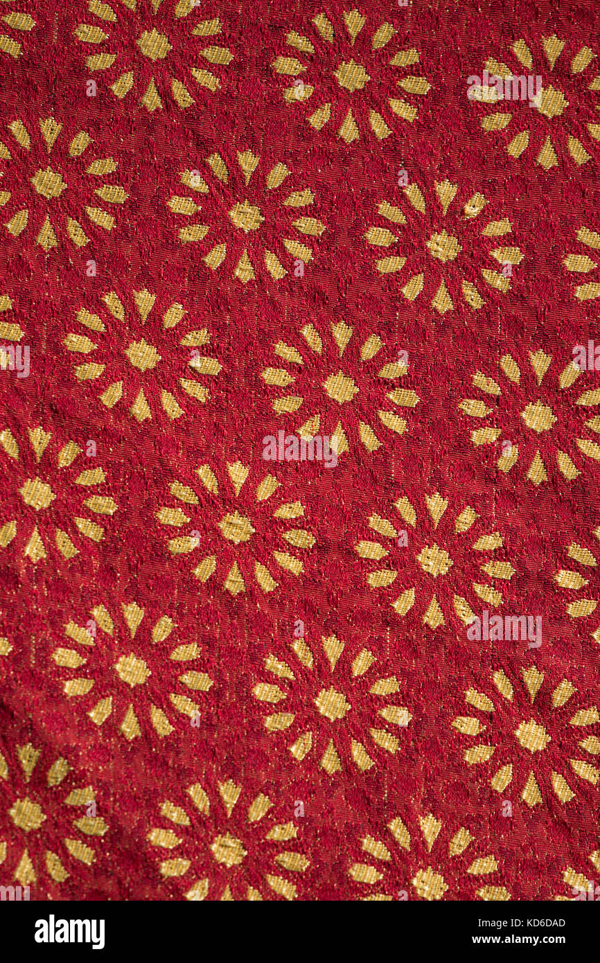 Close up view of Traditional red and golden medieval fabric design ...