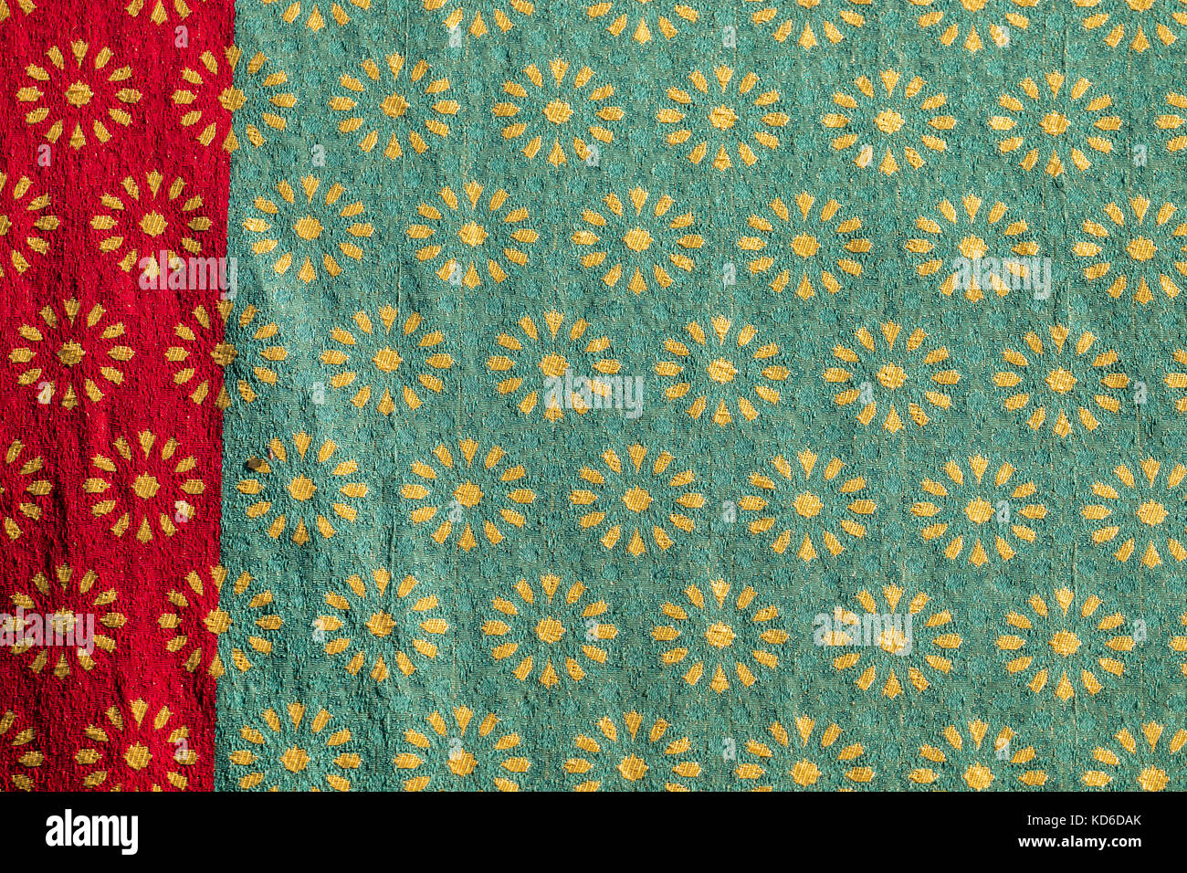 Close up view of Traditional red, green and golden medieval fabric ...