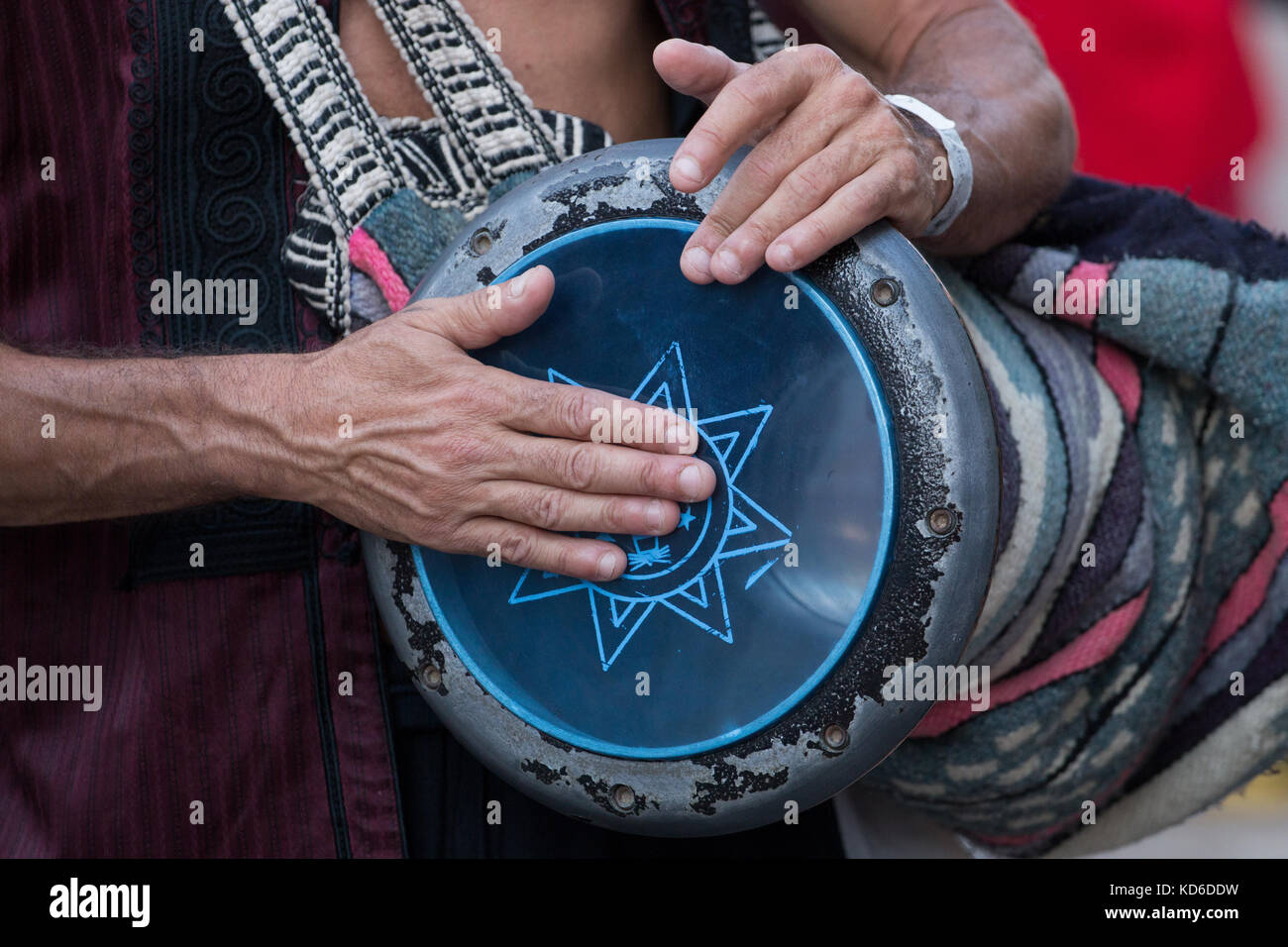Close up view of a man playing a medieval hand drum Stock Photo - Alamy