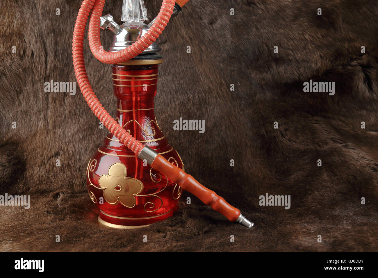Red hookah on the fur Stock Photo - Alamy