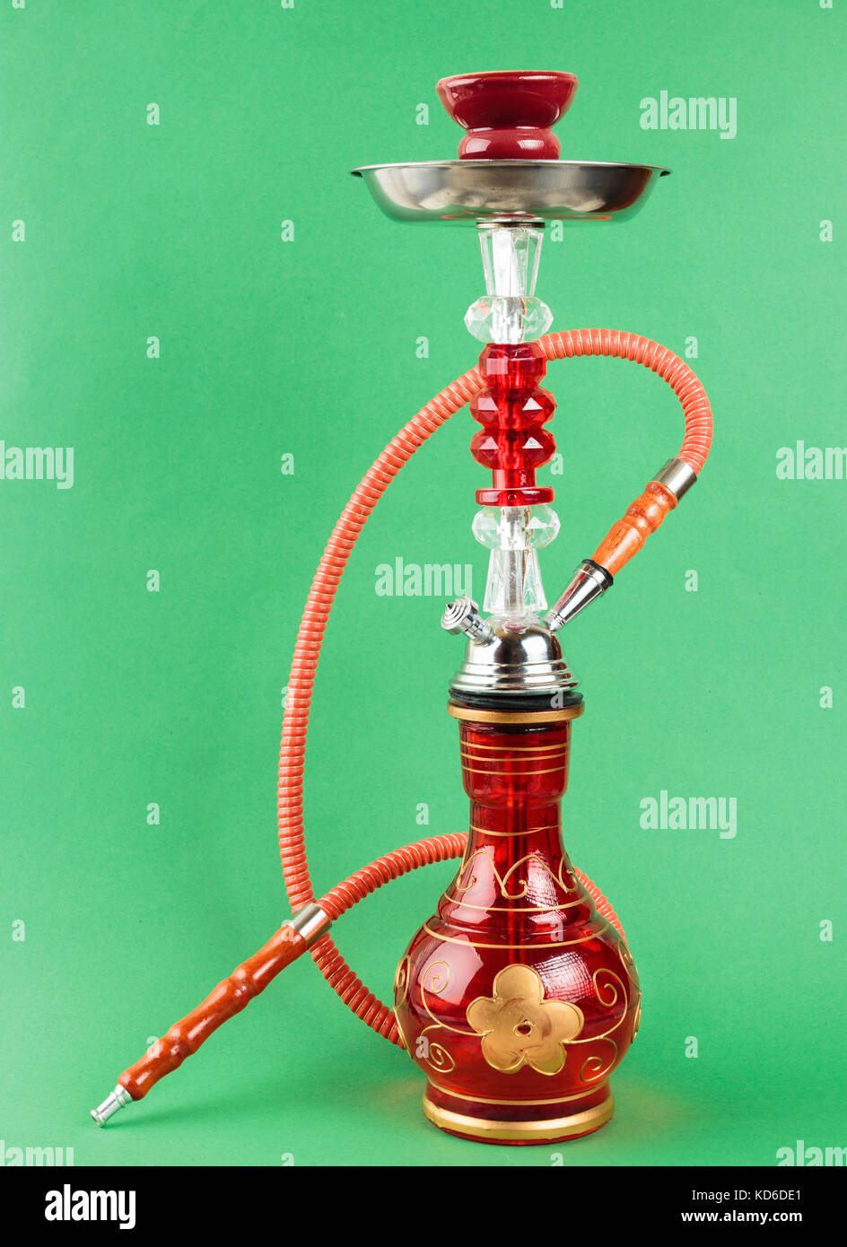 Red hookah on a green background Stock Photo - Alamy