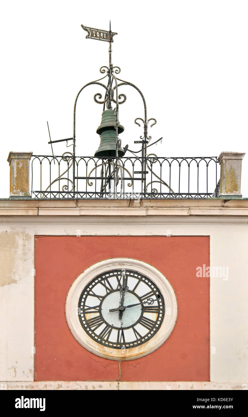 Old tower clock with Roman numerals and bells on top Stock Photo - Alamy