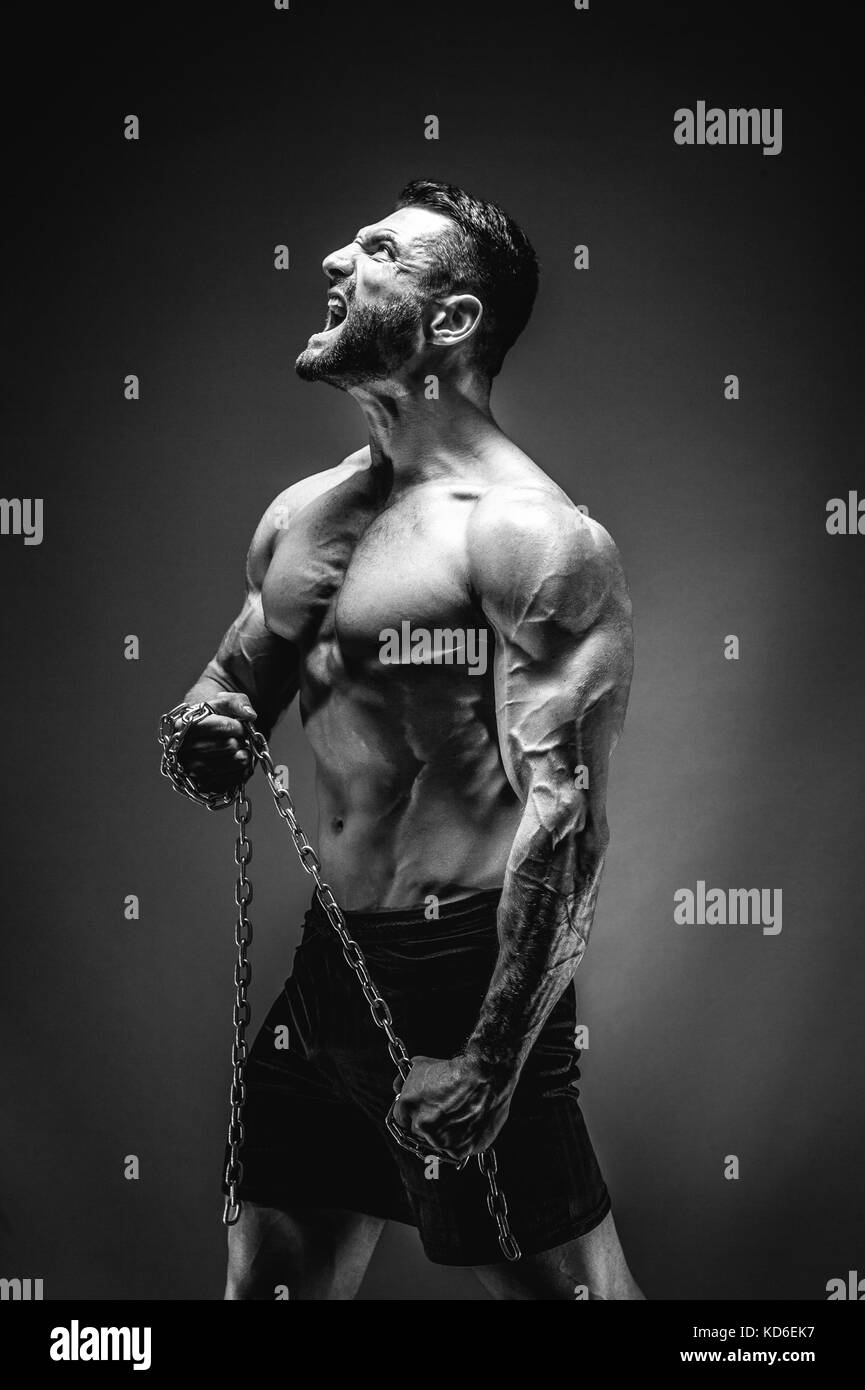 Screaming man with chain Stock Photo - Alamy