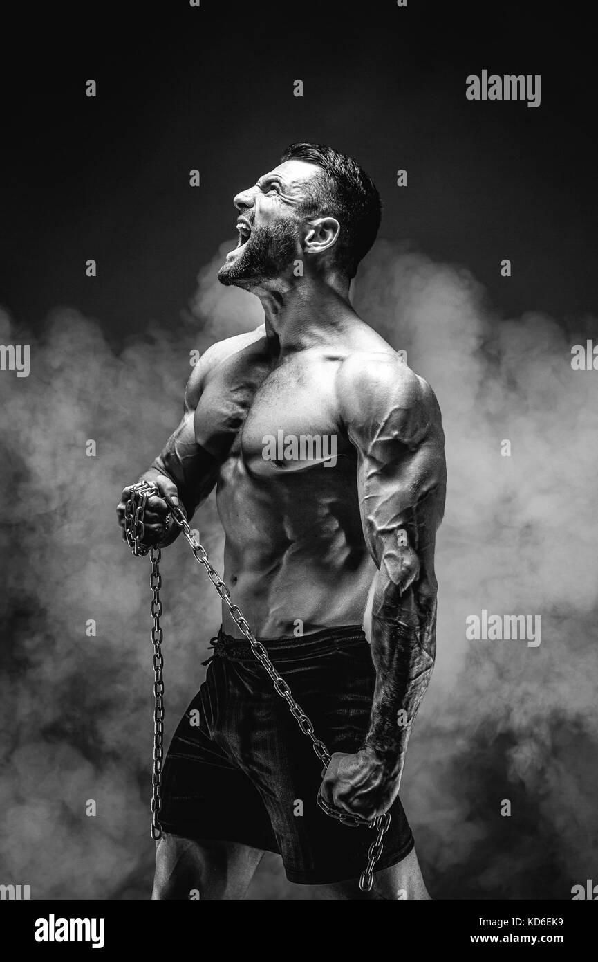 Screaming man with chain Stock Photo - Alamy