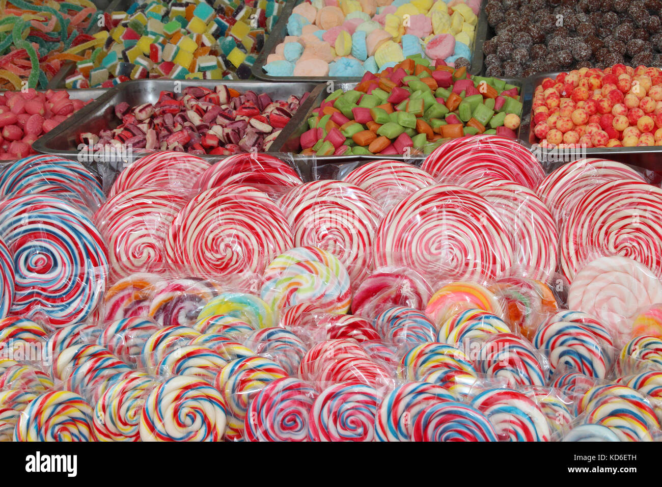 Bunch of colorful sweets on carnival stand Stock Photo - Alamy
