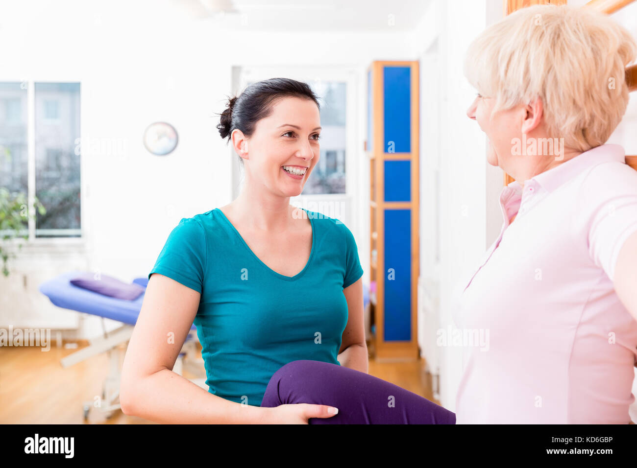 Elderly patient doing mobilization exercise during rehab Stock Photo ...