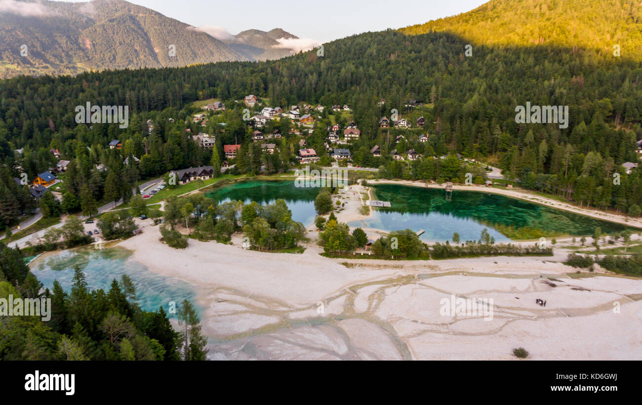 Aerial view of crystal clear lake surrounded with town Stock Photo - Alamy