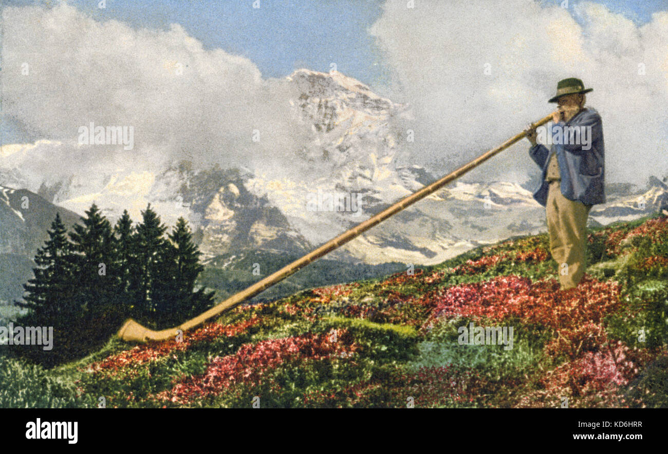 Man playing Alphorn in the Swiss Alps Stock Photo - Alamy