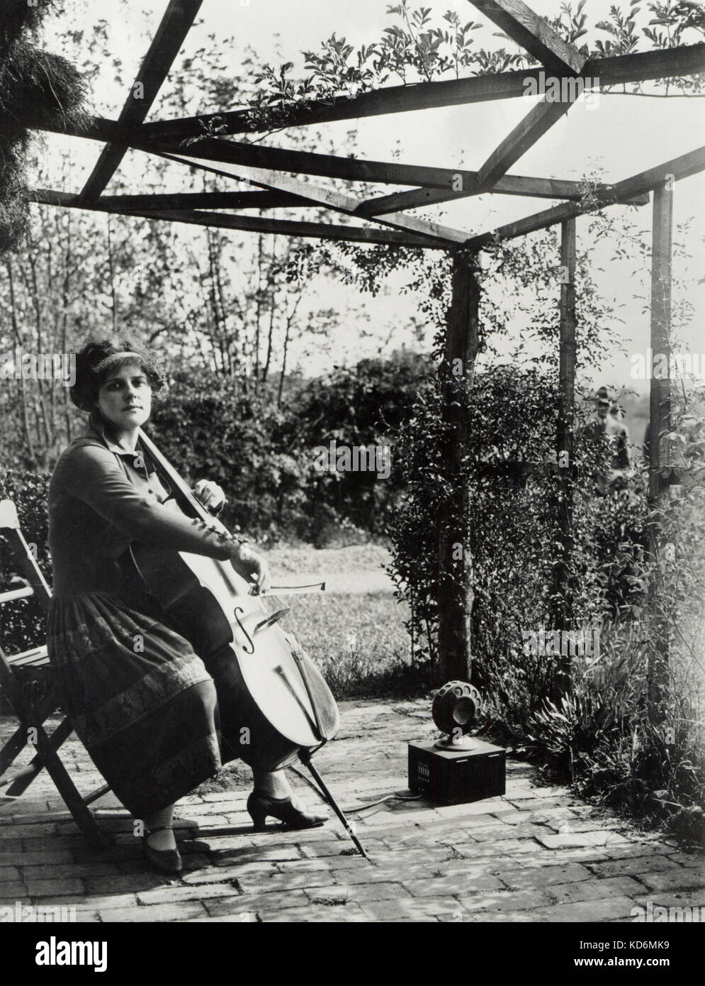 Beatrice Harrison playing cello in the garden recording with large ...