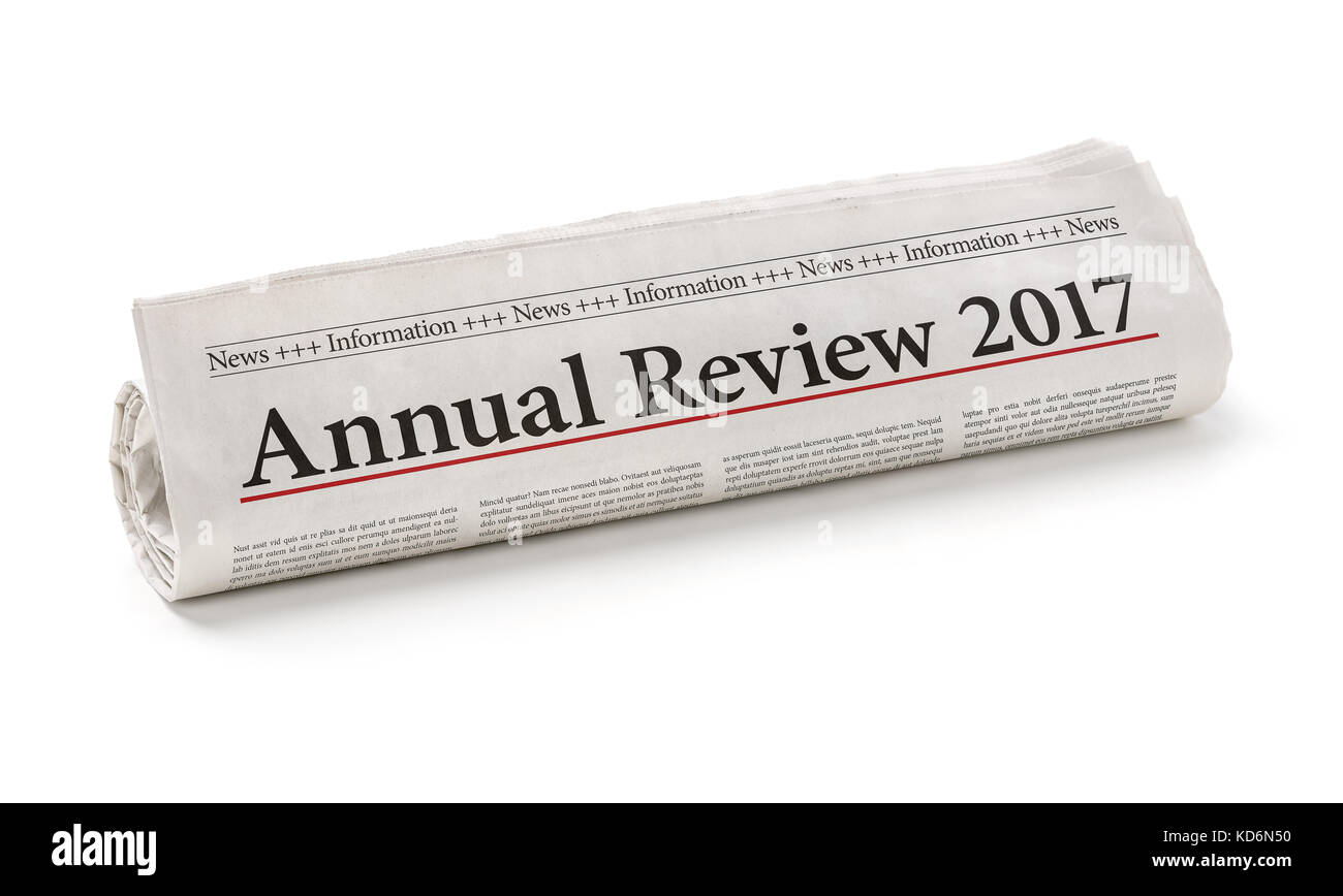 Rolled newspaper with the headline Annual review 2017 Stock Photo - Alamy