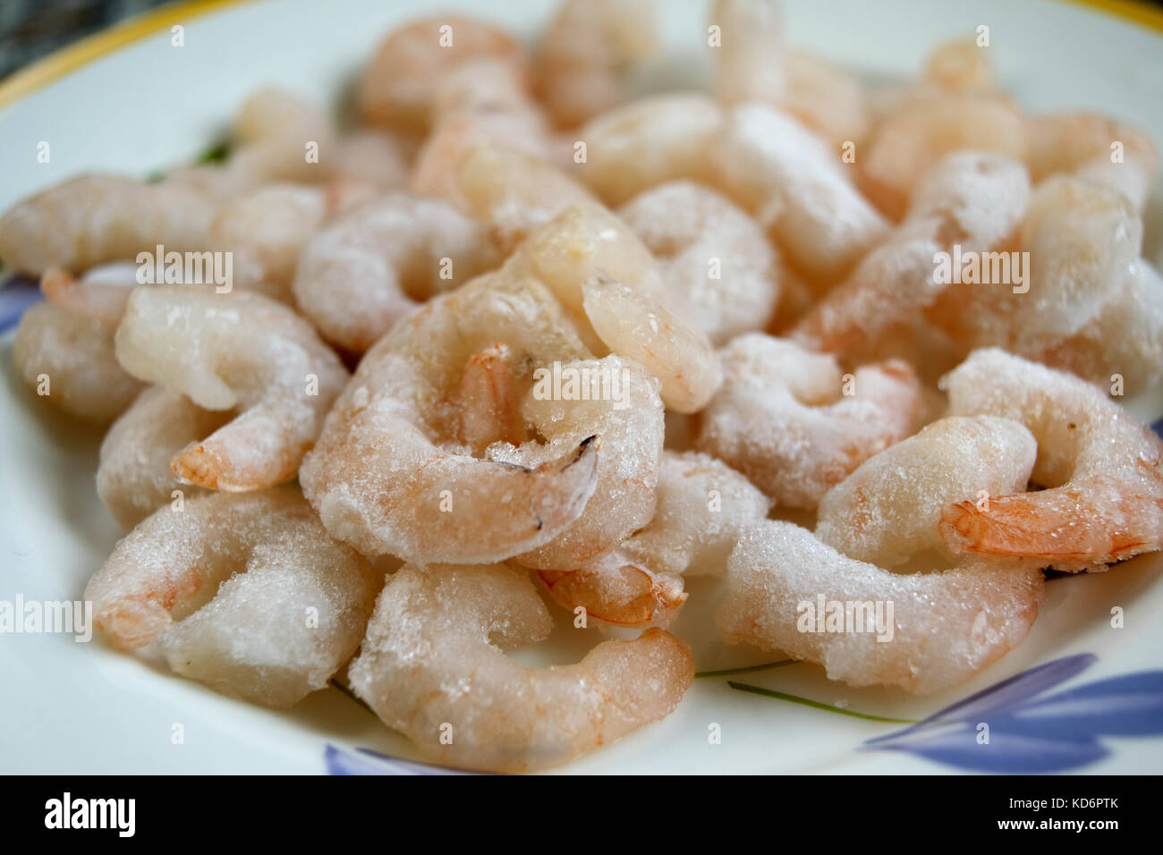 frozen shrimps put in a dish to defrost Stock Photo - Alamy