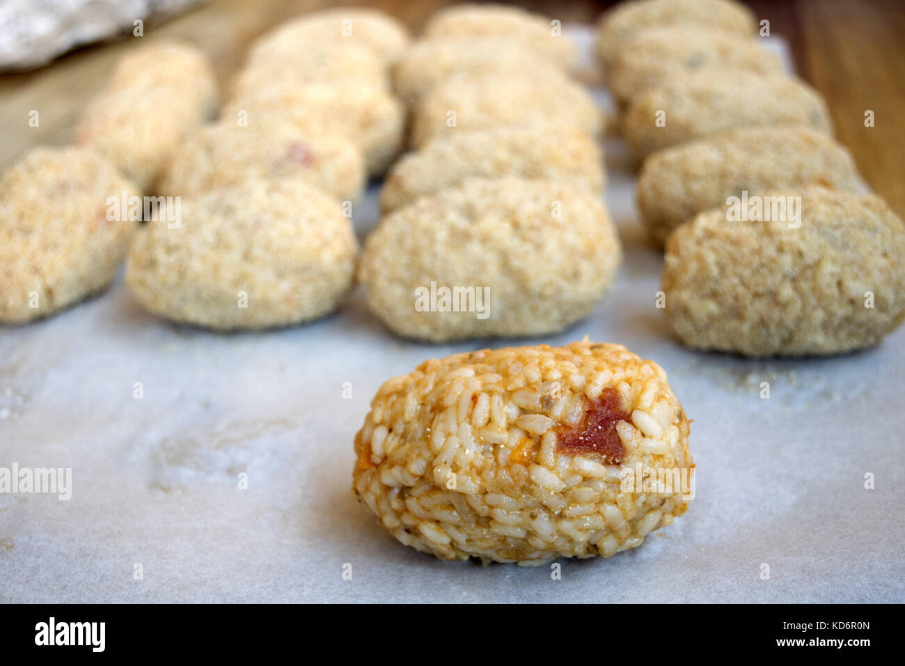 preparing stuffed rice croquettes to be fried Stock Photo - Alamy