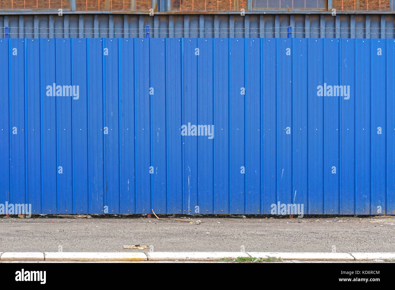 Corrugated steel metal blue fence exterior Stock Photo - Alamy