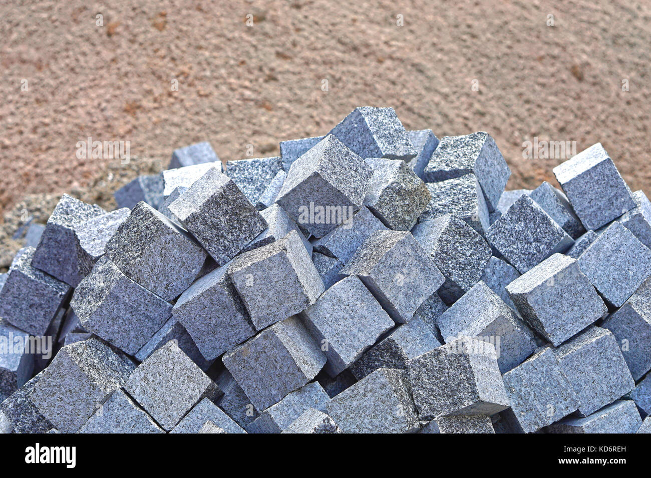 Big bunch of cobblestone bricks at construction site Stock Photo - Alamy
