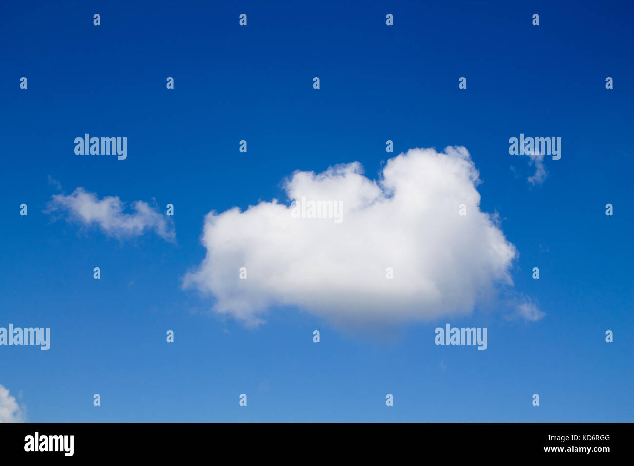 Small white cloud on a blue sky Stock Photo - Alamy