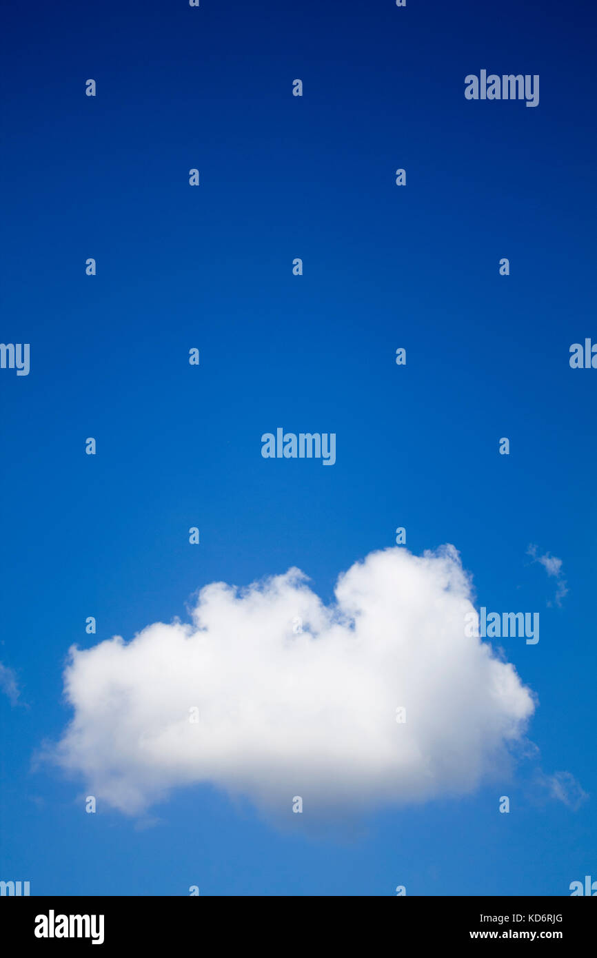 Small white cloud on a blue sky Stock Photo - Alamy