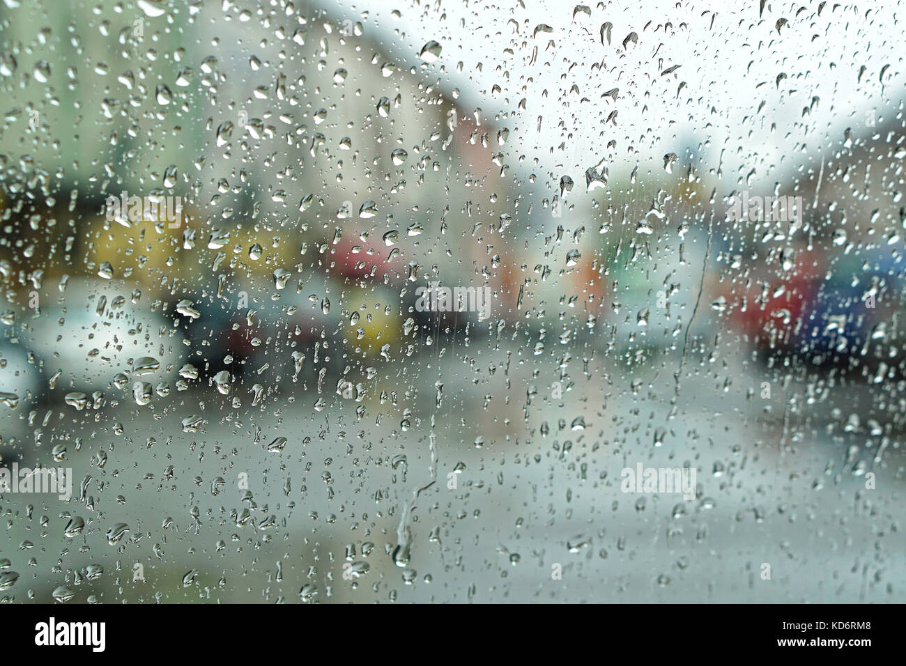 Rainy day abstract weather photo trough wet window Stock Photo - Alamy