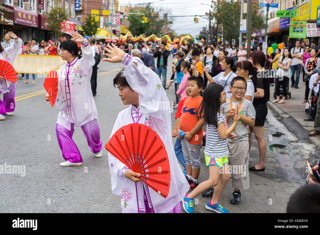 Marchers display their Tai Chi prowess on Eighth Avenue in the Sunset Park neighborhood in ...