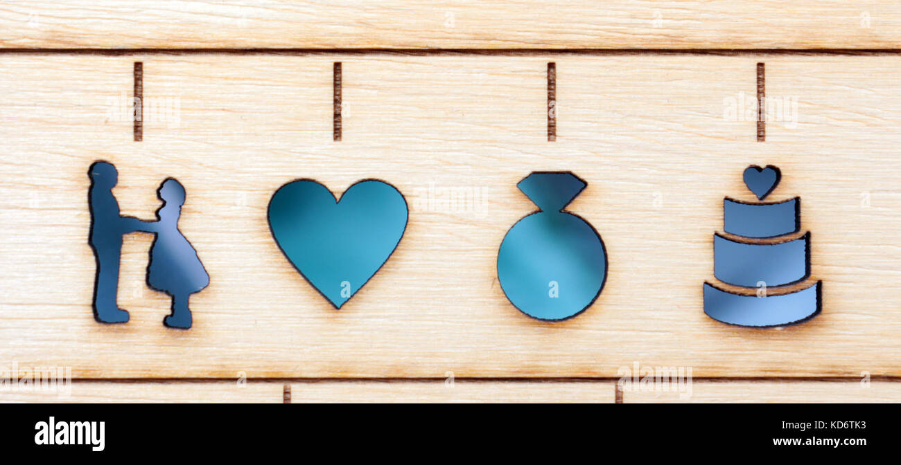 laser engraved symbols of wedding bride, groom, heart, ring and cake ...