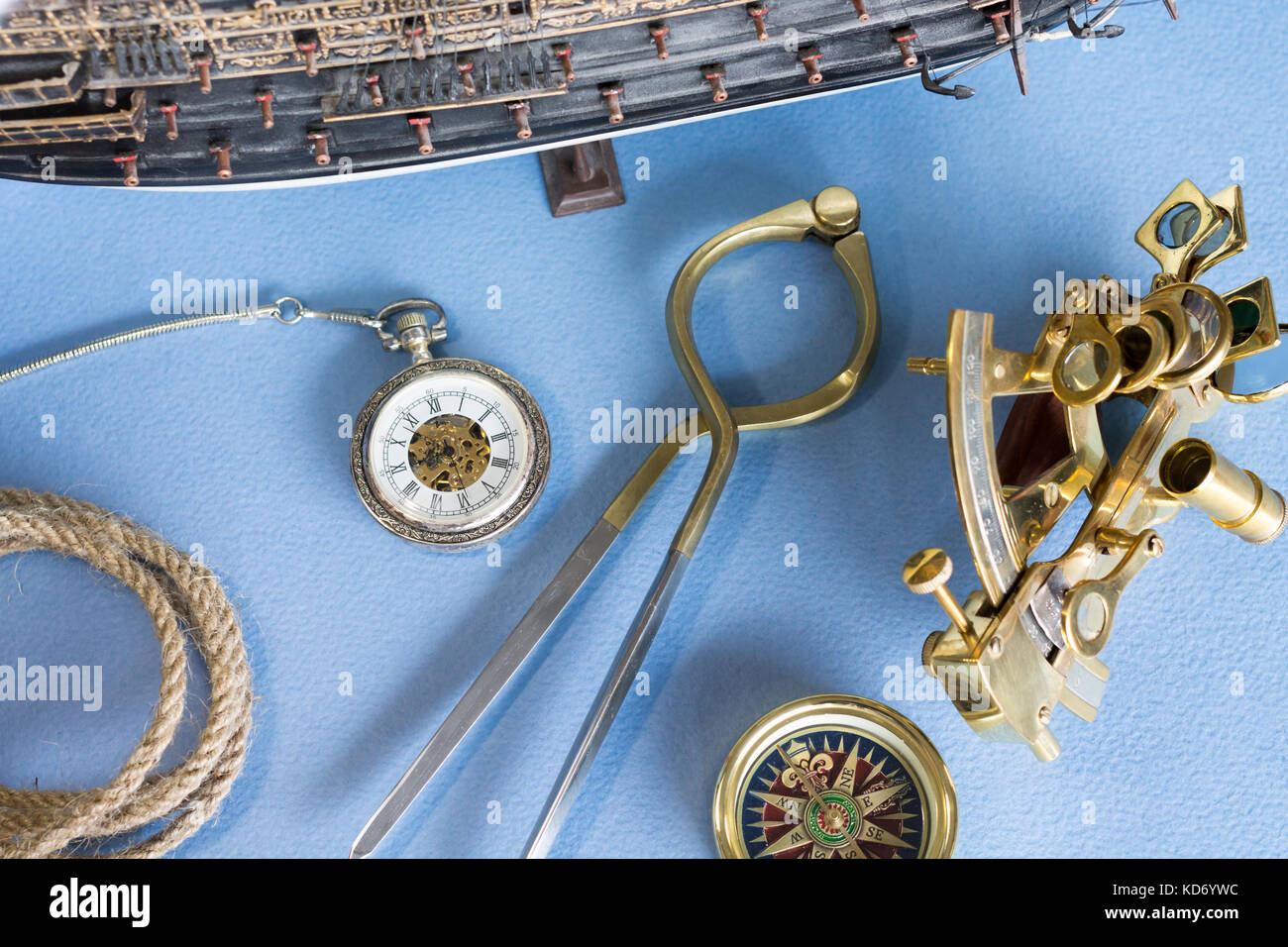 Various pieces of nautical equipment on blue background Stock Photo - Alamy