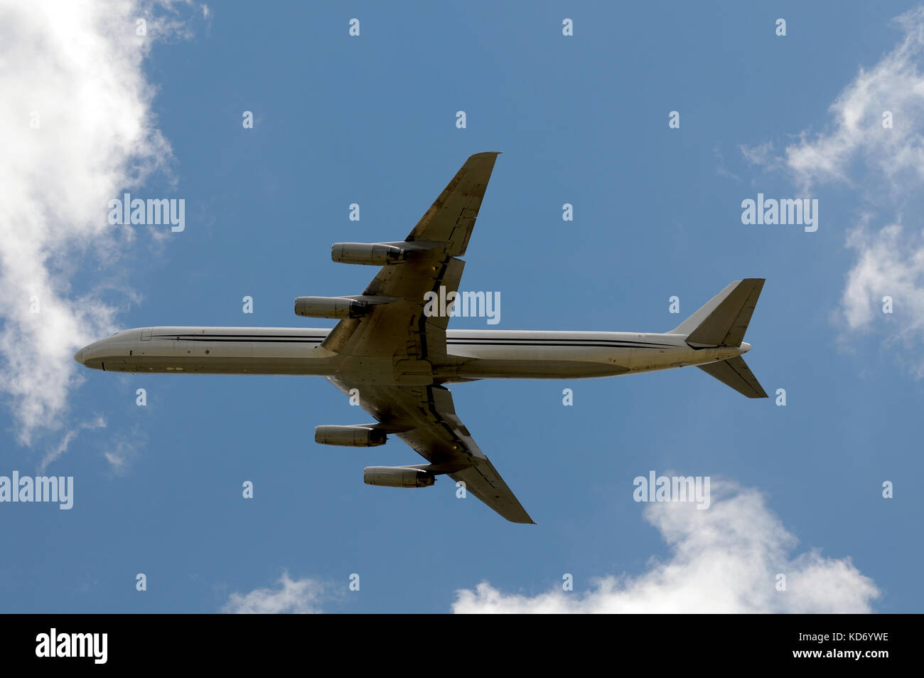Long white jet airplane passing voerhead Stock Photo - Alamy