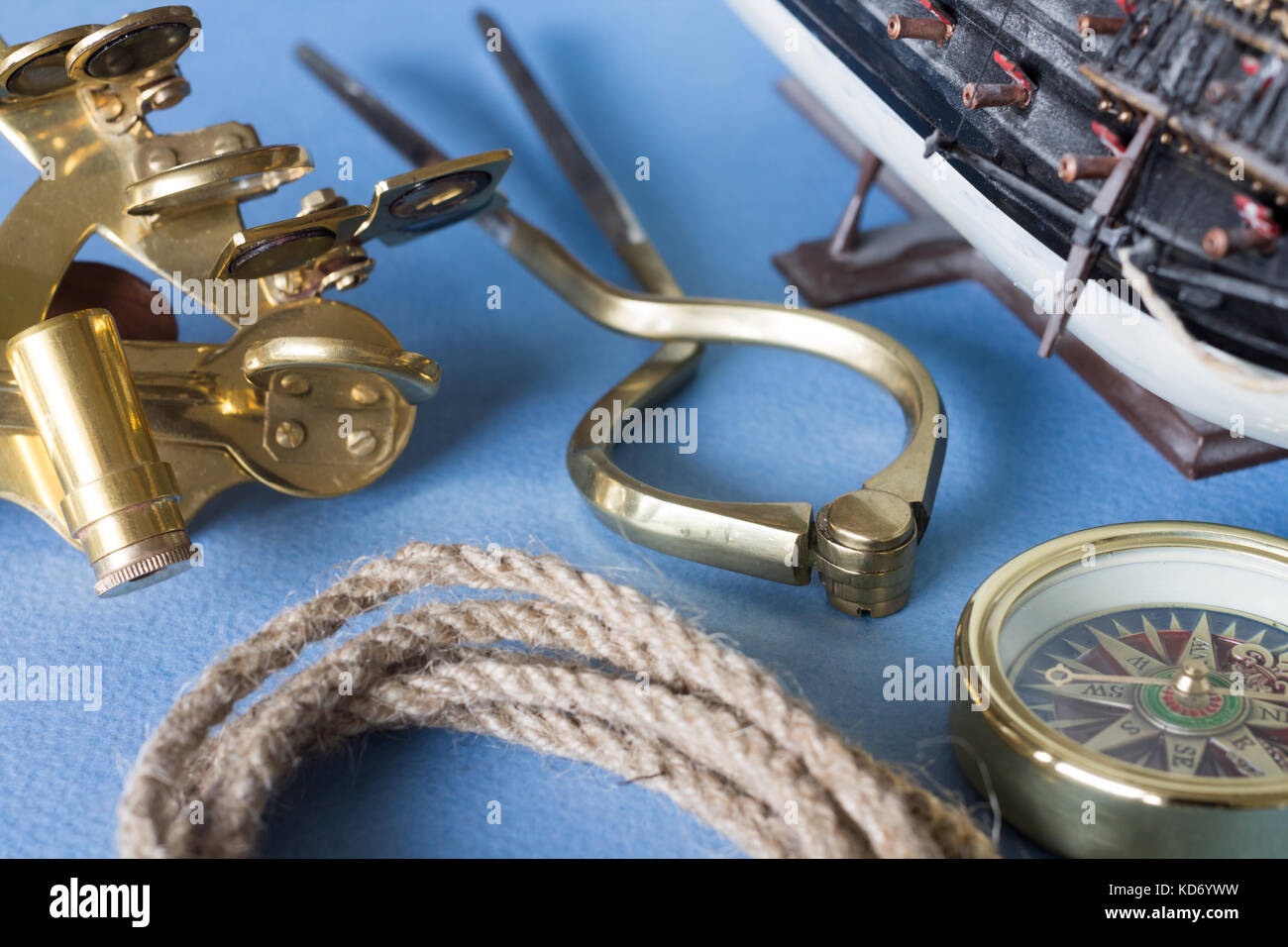 Various pieces of nautical equipment on blue background Stock Photo - Alamy