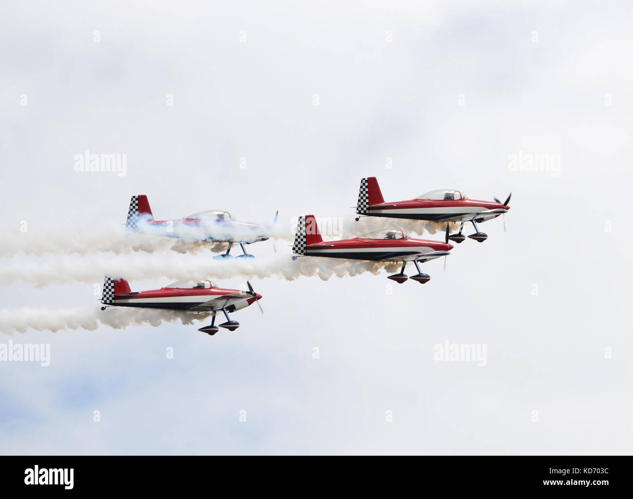 Team of pilots flying airplanes in formation Stock Photo - Alamy