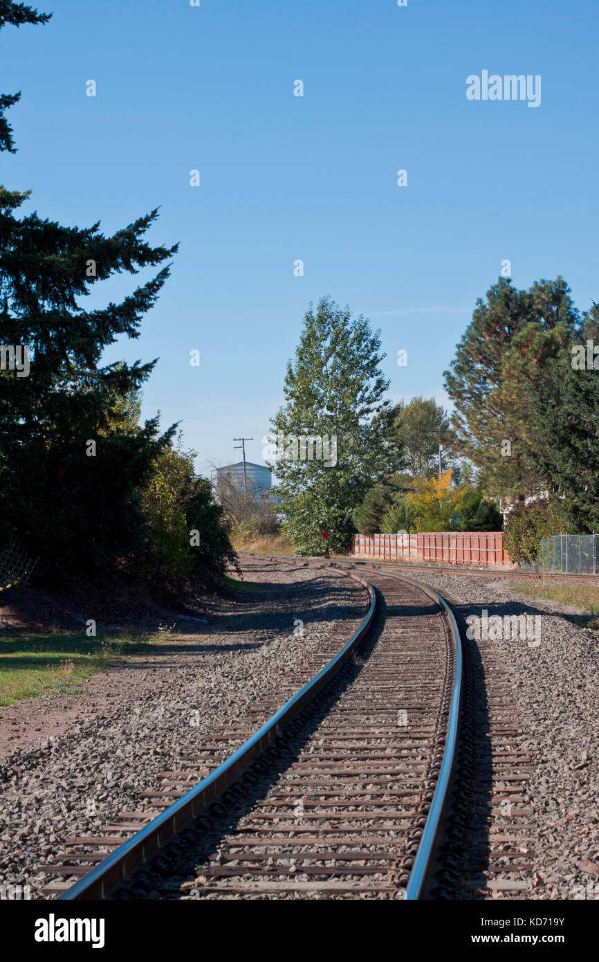 Train tracks through a rural neighborhood Stock Photo - Alamy