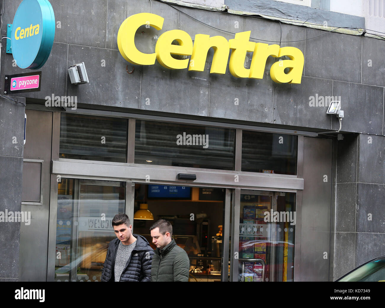 People pass a Centra shop in Dublin's city centre Stock Photo - Alamy