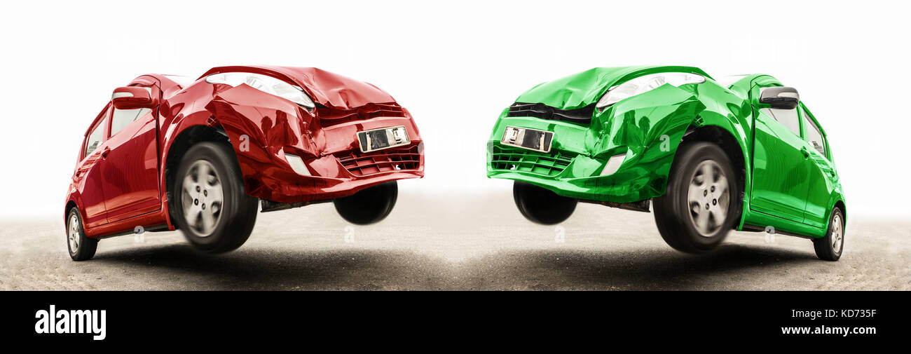 Accident of two cars at a front crash on the road. The green and red ...