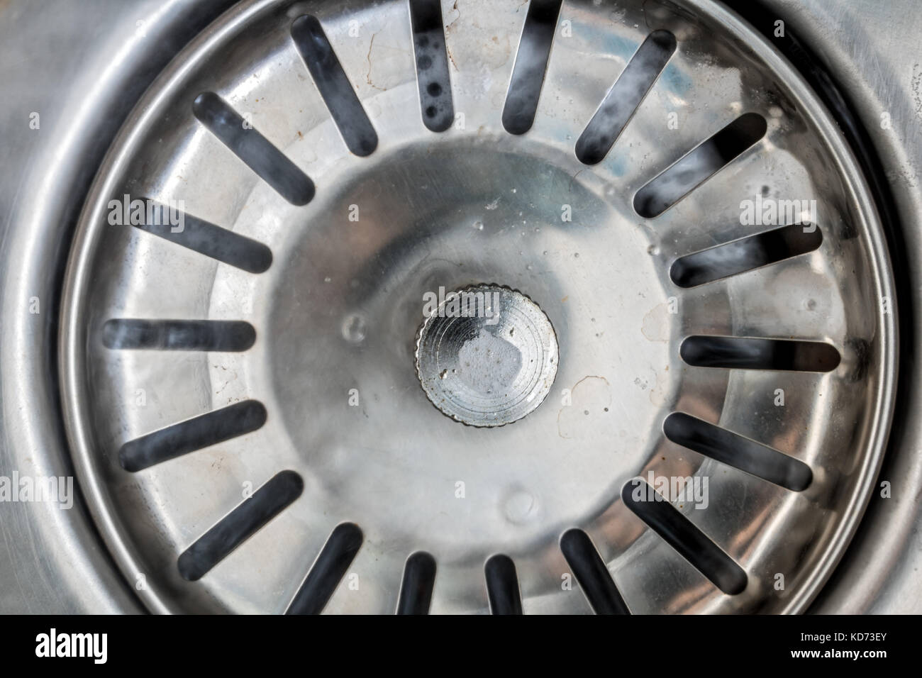 Drain hole in metal sink, macro view. Mechanically adjustable drain ...