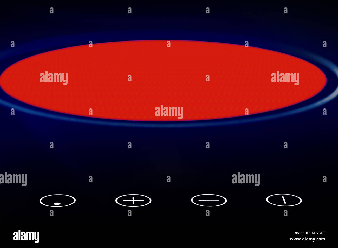 Modern induction cooker with control buttons. The electric hob closeup ...