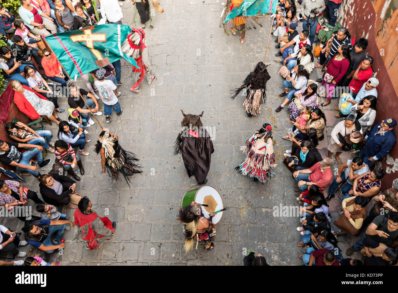 A religious procession carries a statue of St Michael through the ...