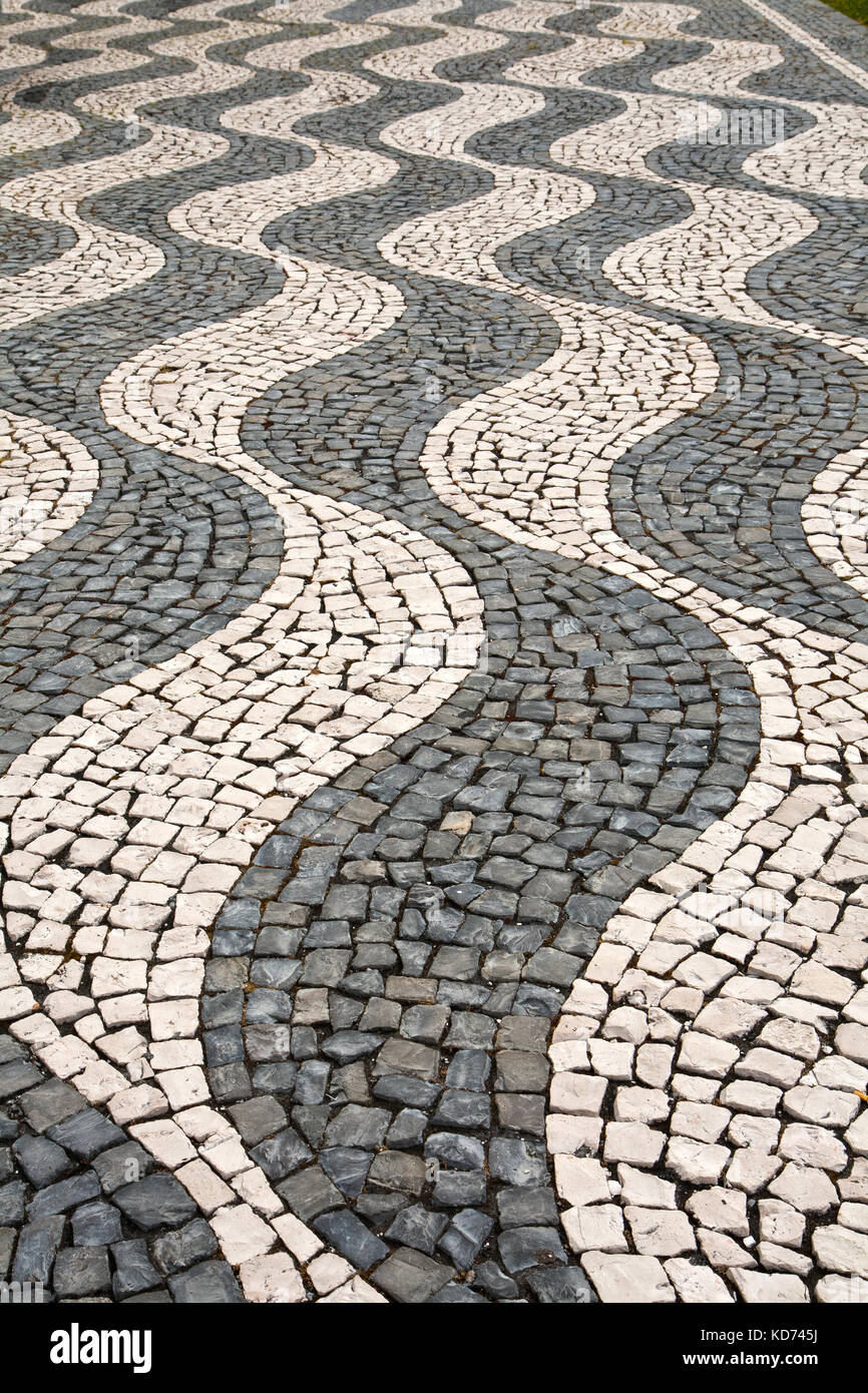bi-color pattern on the sidewalk, paved with stone blocks Stock Photo ...