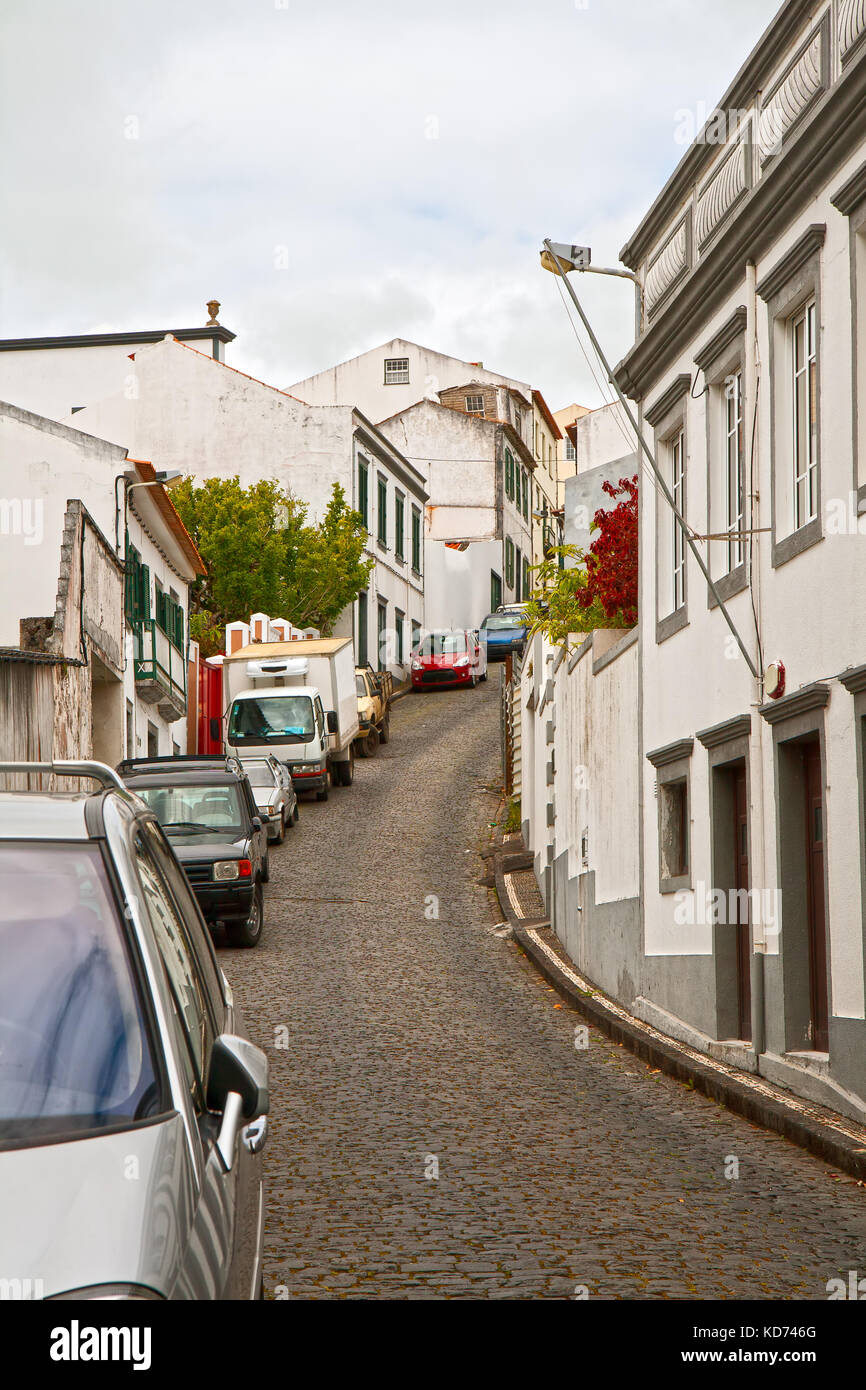 The narrow street on a steep slope with parked cars Stock Photo - Alamy