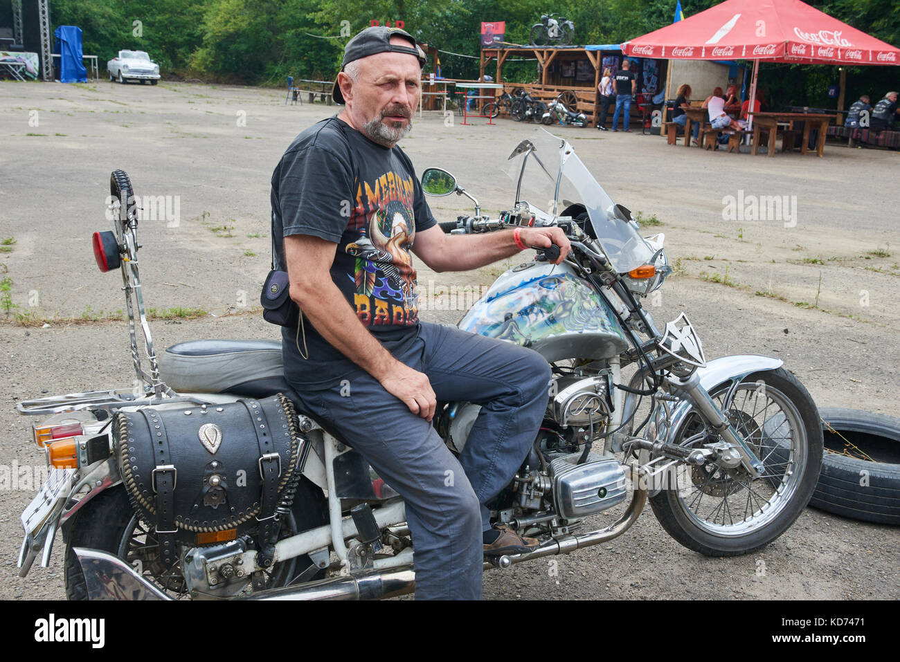 man is sitting on his motorcycle Stock Photo - Alamy