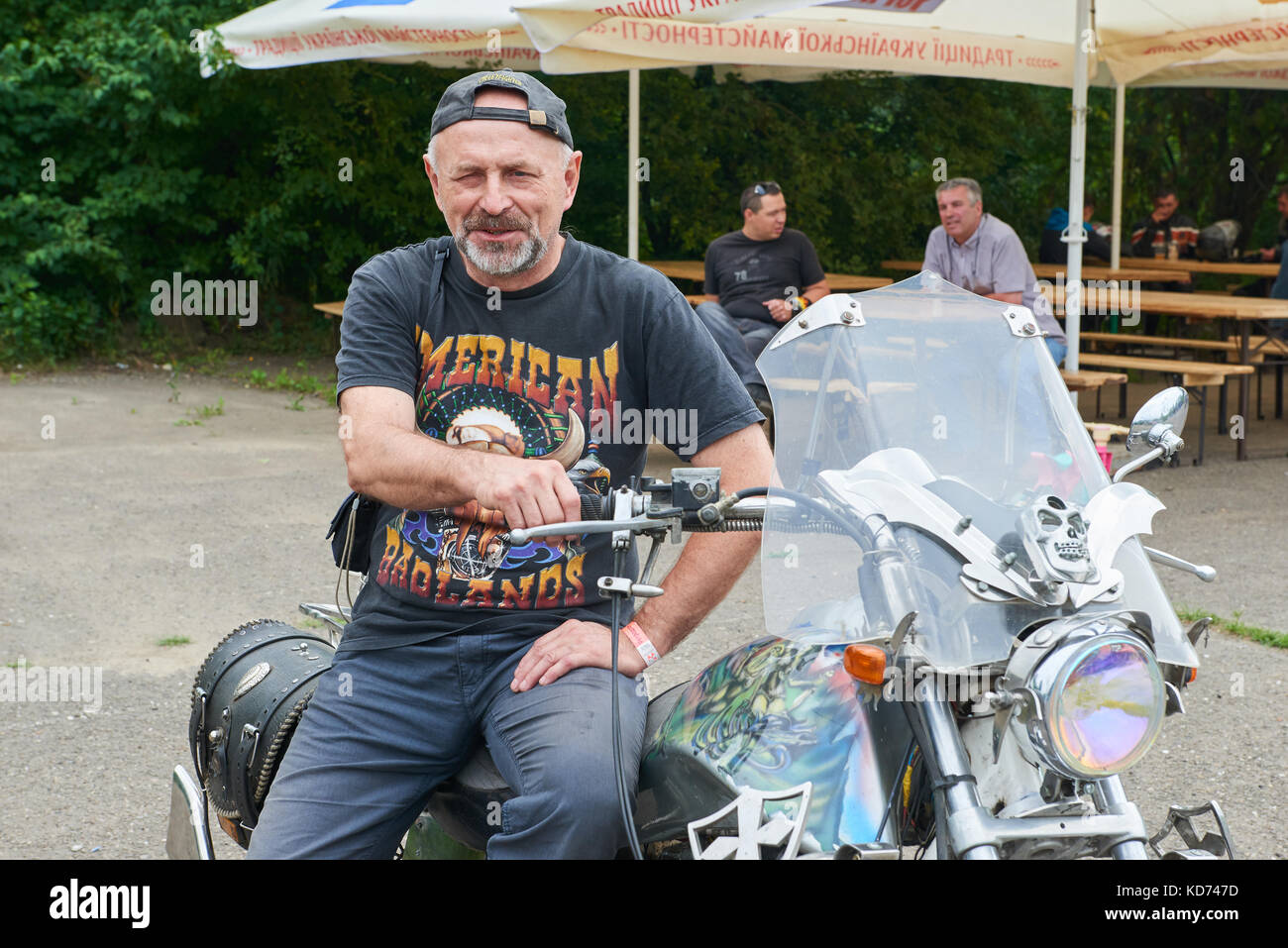 man is sitting on his motorcycle Stock Photo - Alamy