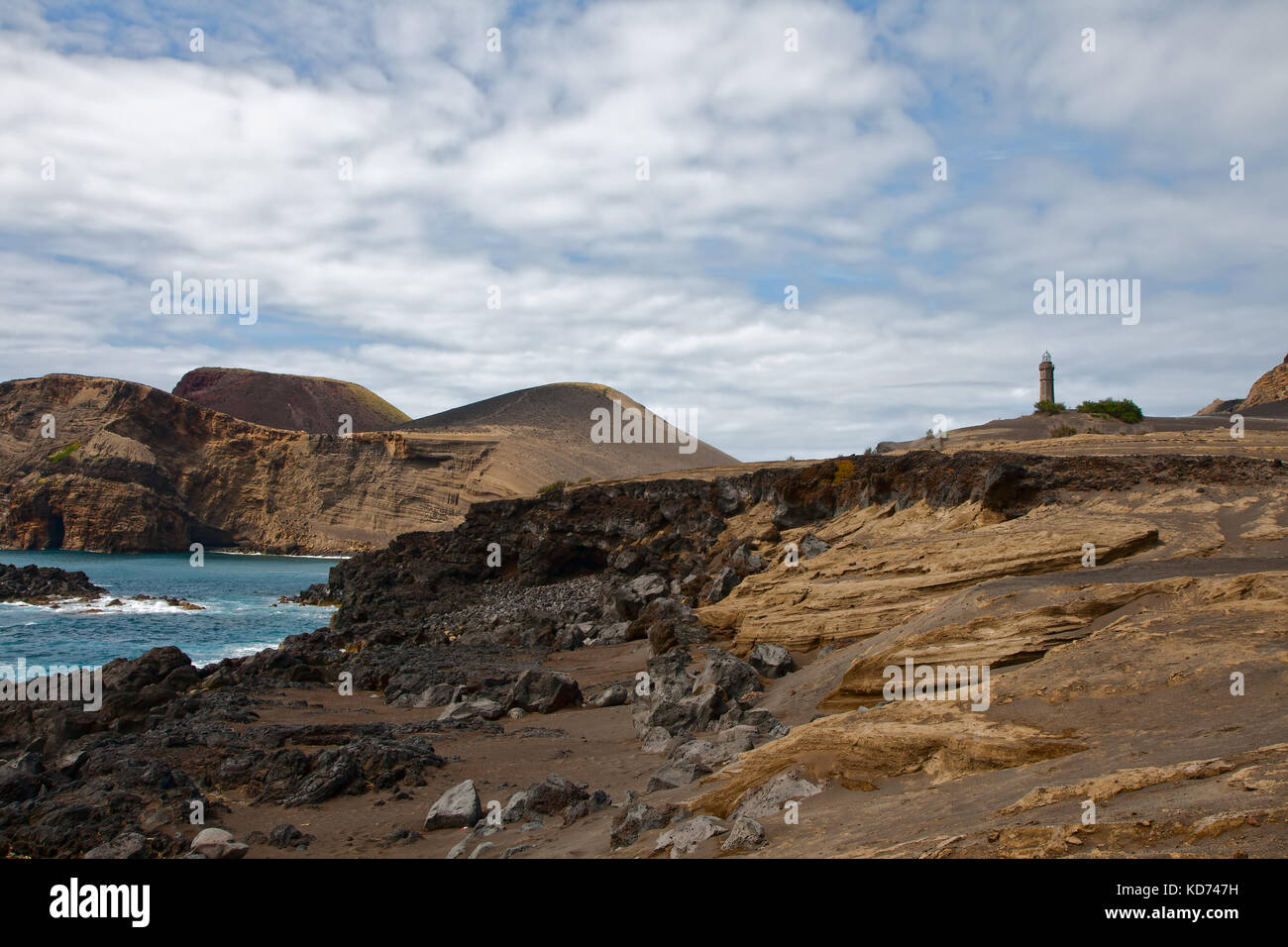 Deserted coast of volcanic island Fajal with a beacon on a hill Stock ...