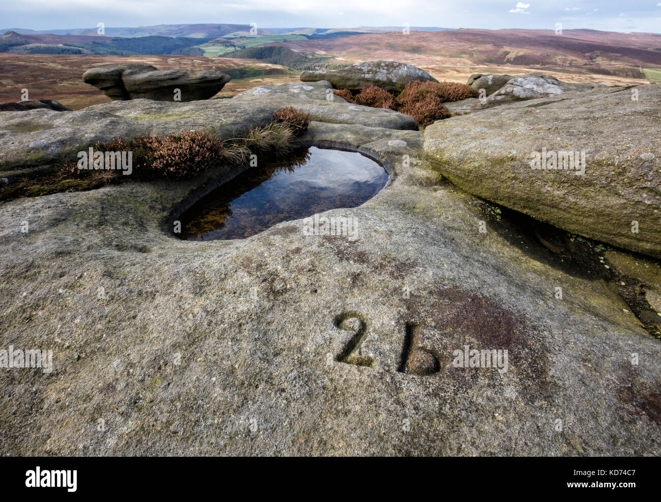 Numbered carved rock basin 26 on Stanage Edge near Hathersage in the ...