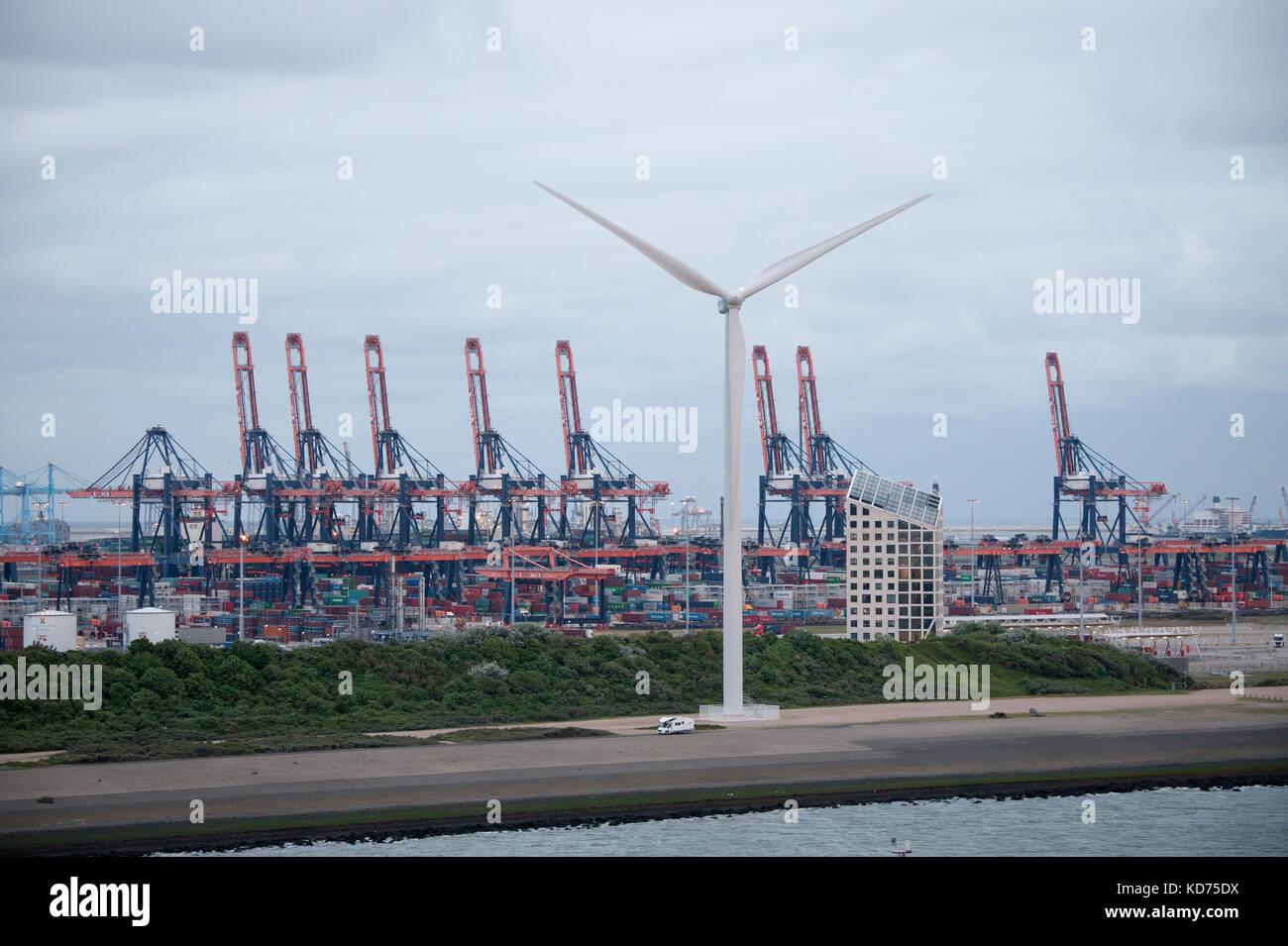 Wind turbine at Port of Rotterdam at dawn, viewed from offshore Stock ...