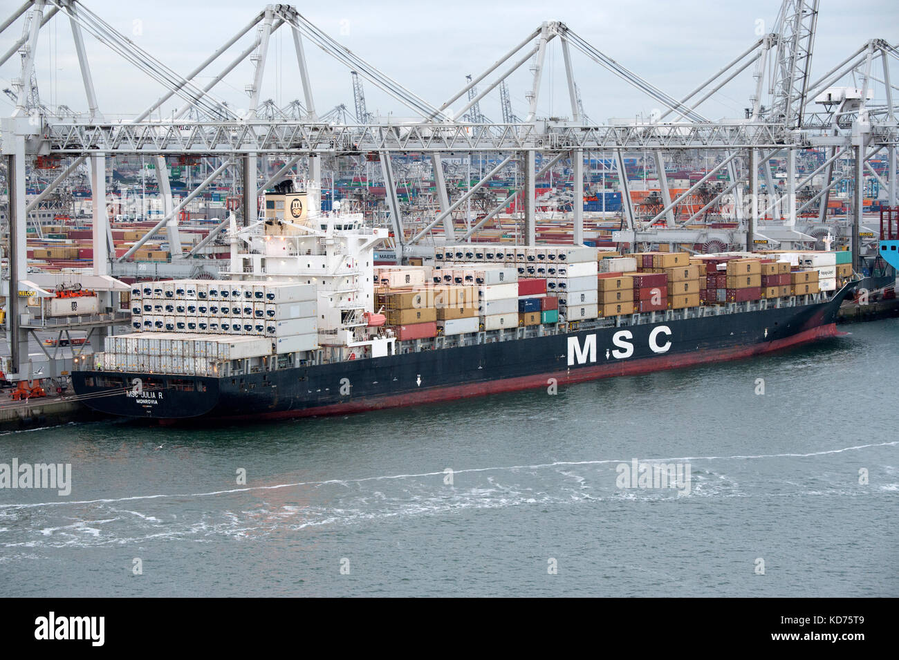Rotterdam container port with container ships, cargo ships and cranes ...