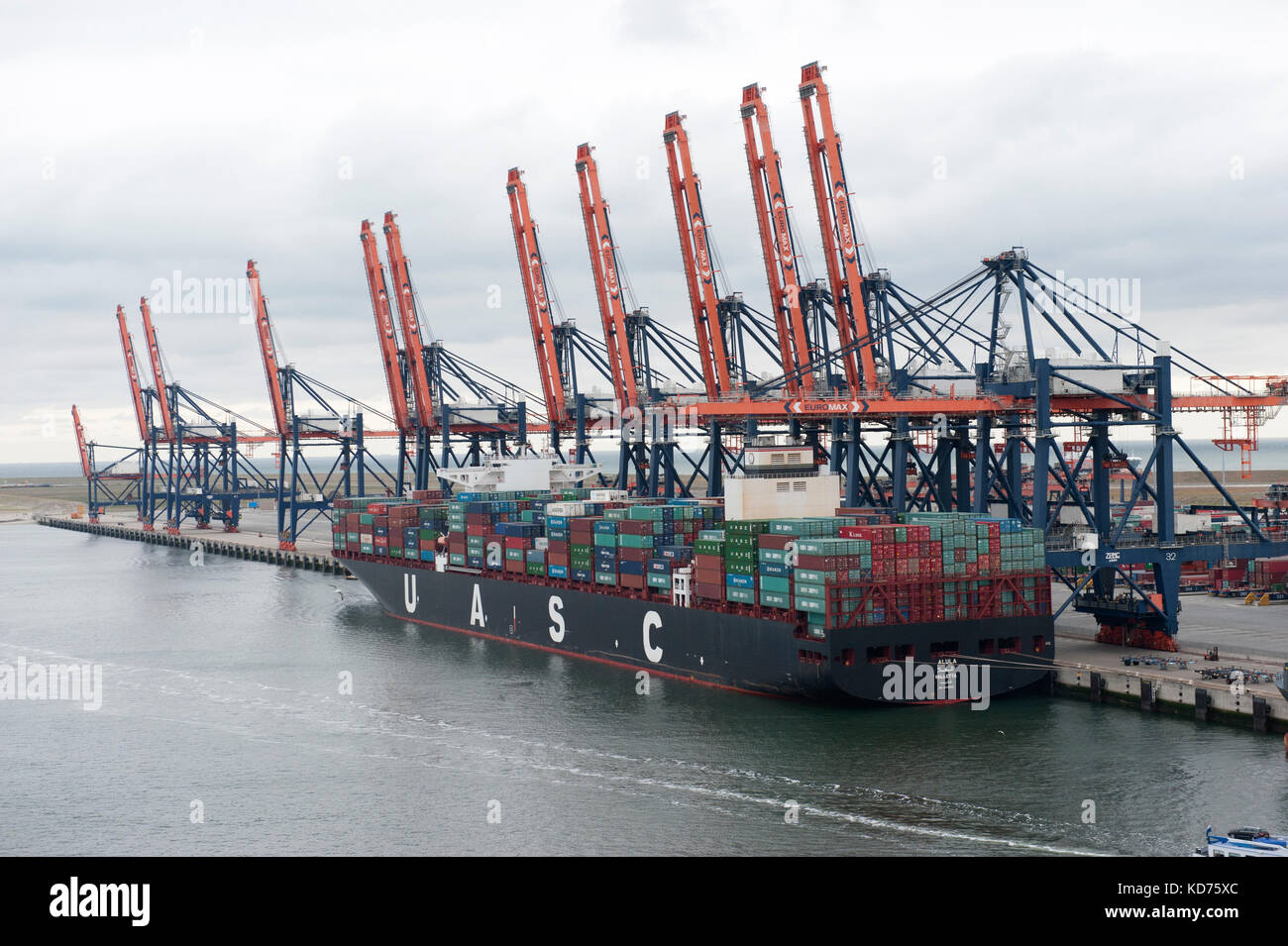 Rotterdam container port with container ships, cargo ships and cranes ...