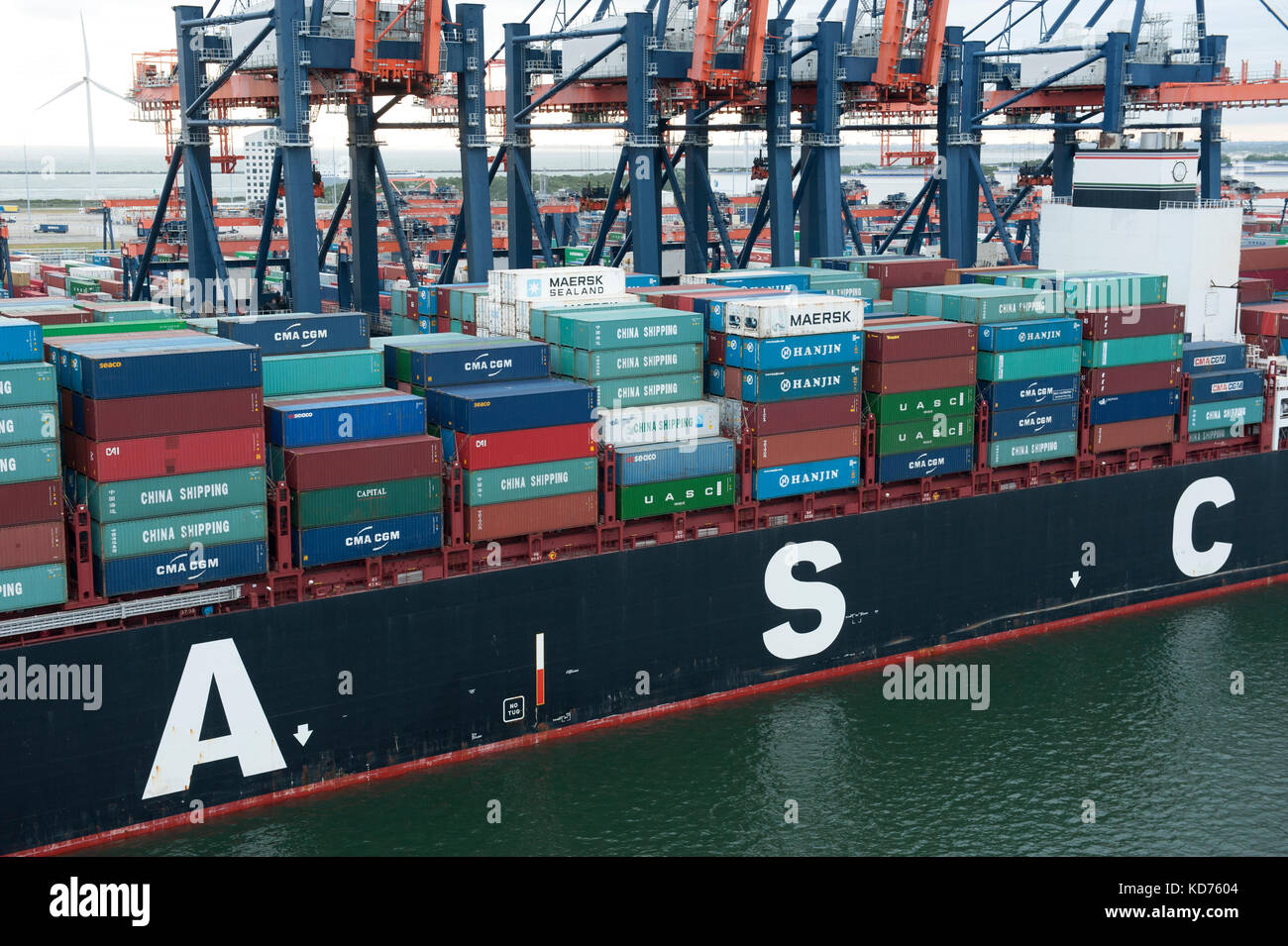 Rotterdam container port with container ships, cargo ships and cranes ...