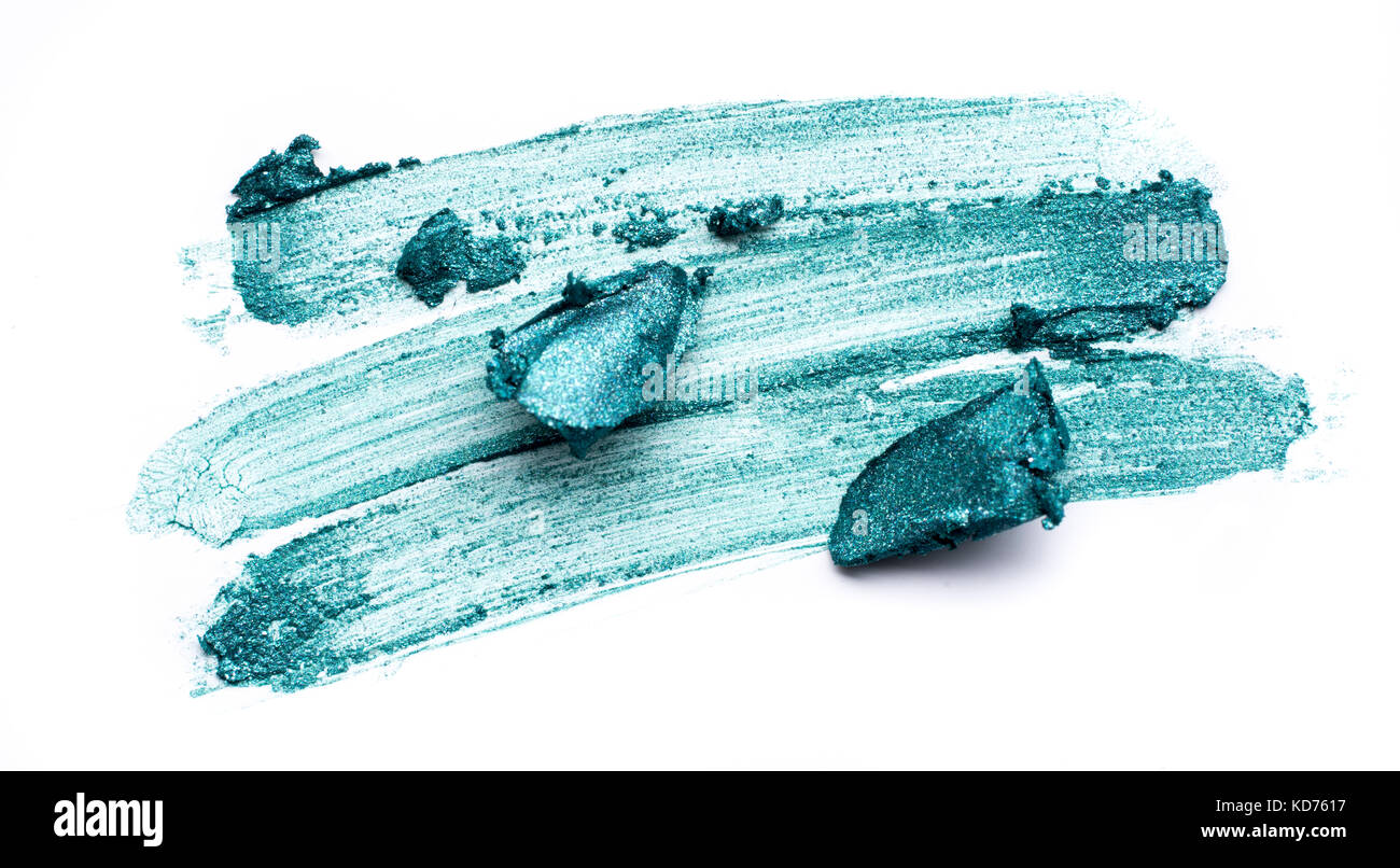 Green smear of cosmetic products on a white background Stock Photo - Alamy