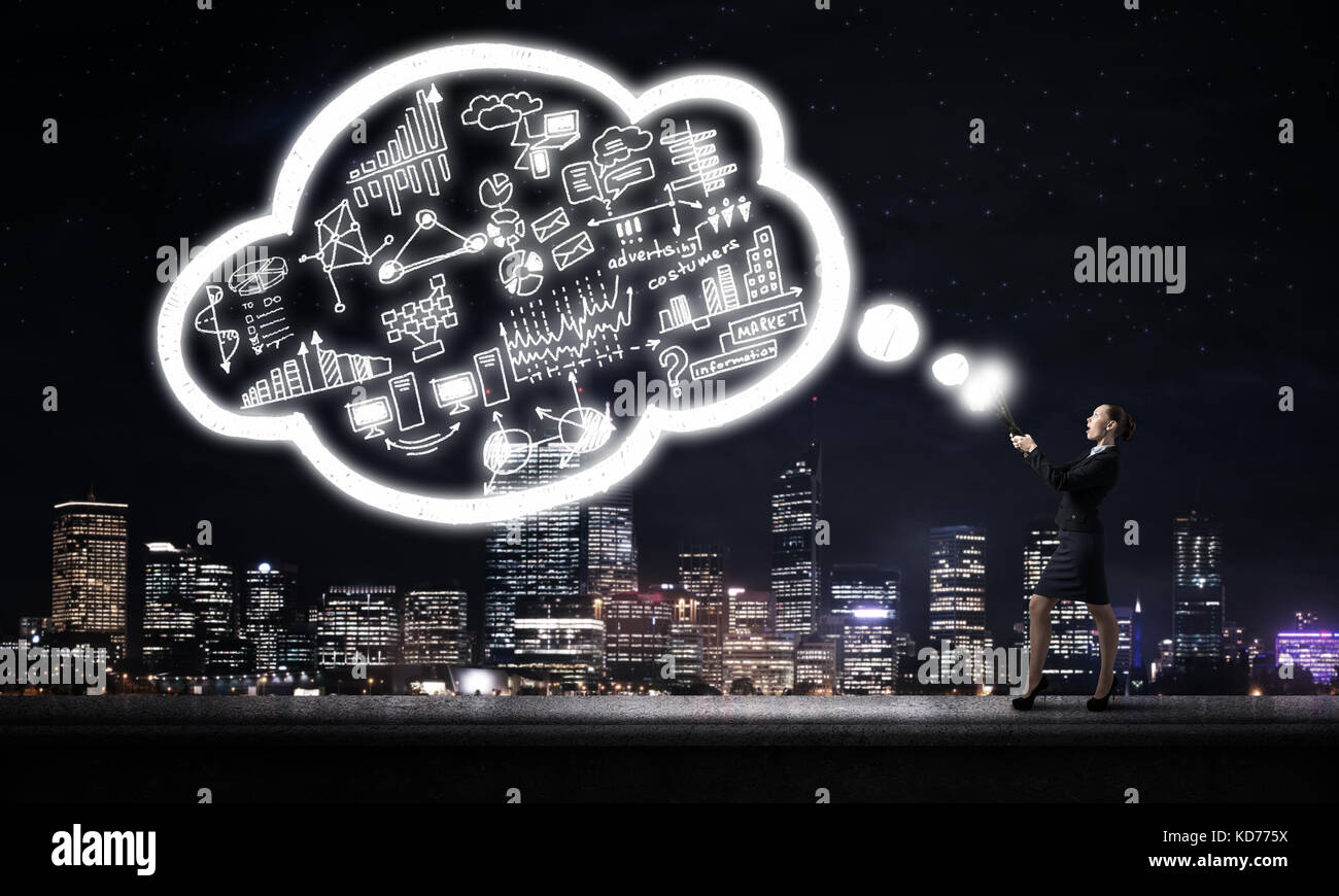 Woman throwing light on her ideas Stock Photo - Alamy