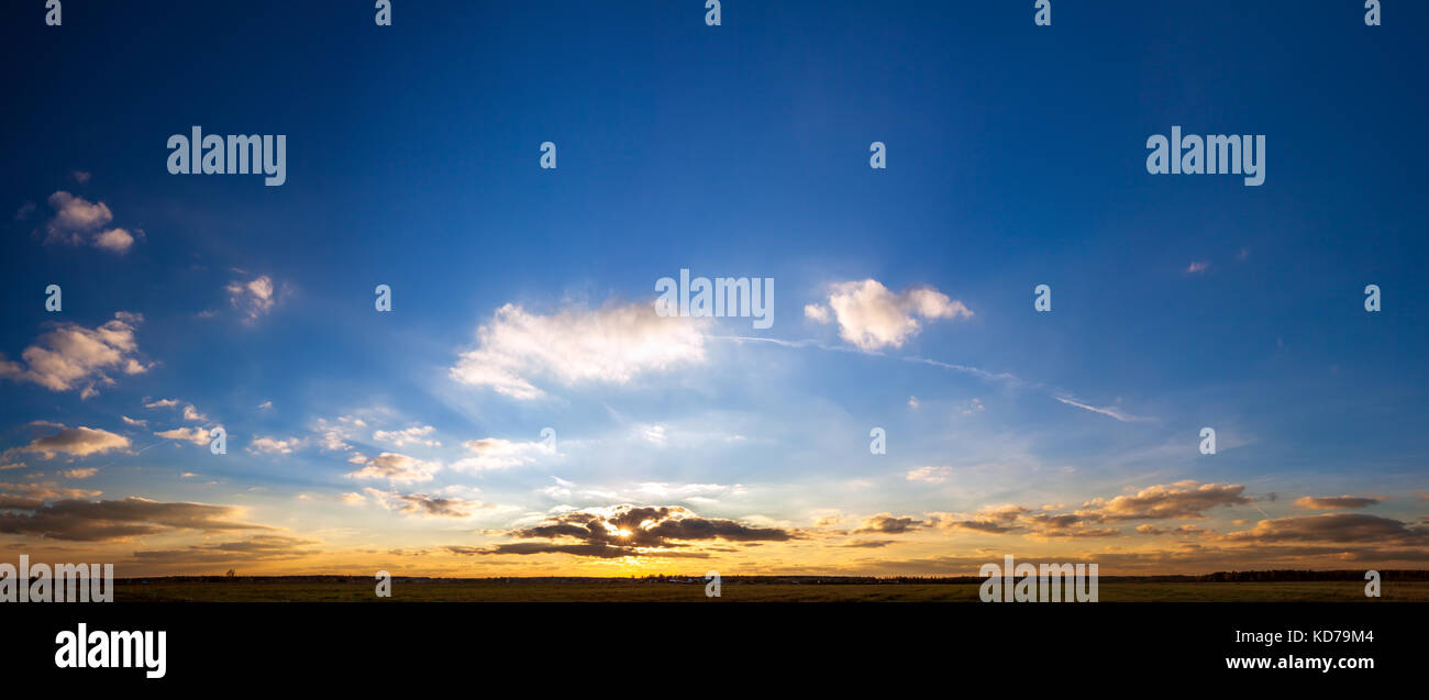 beautiful landscape panorama with blue sky, clouds and sunset ...