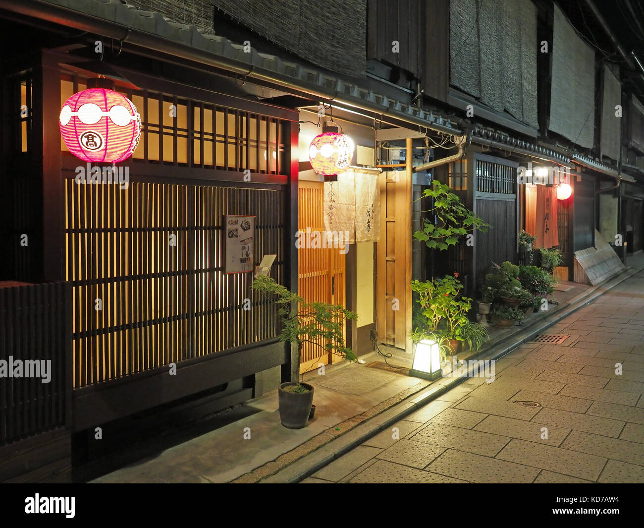 View of the entrance to a traditional Japanese restaurant at night in ...