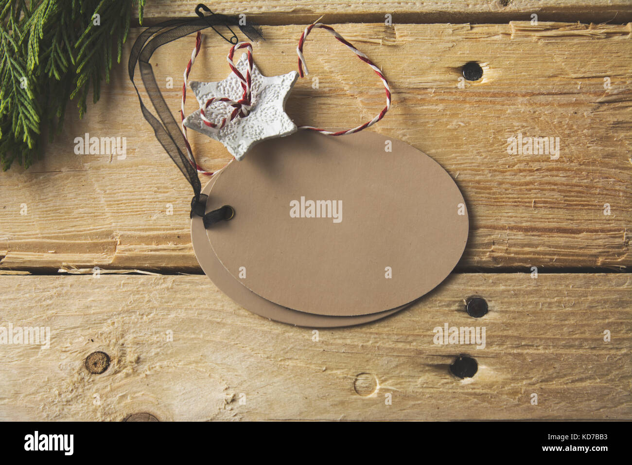 label oval frame branches and white star on wooden background Stock ...