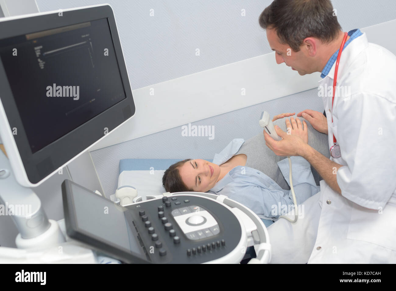 doctor assuring the pregnant woman before the ultrasound Stock Photo ...